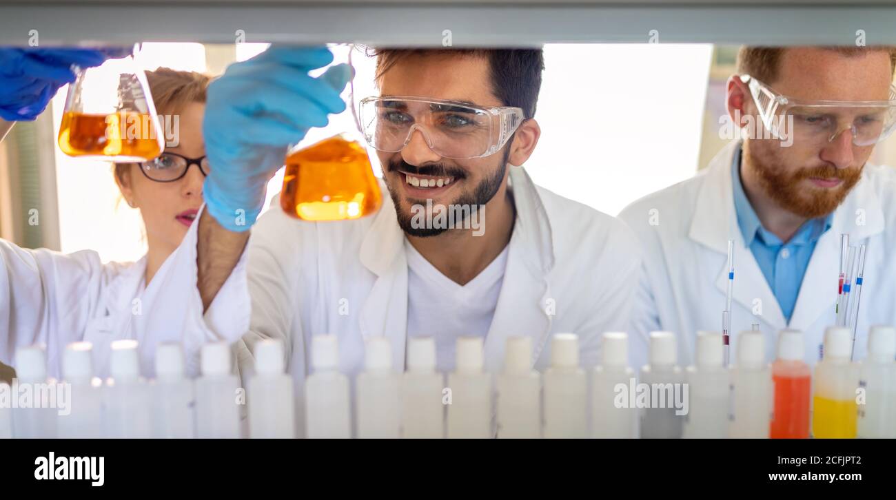 Group of students working at the laboratory Stock Photo - Alamy