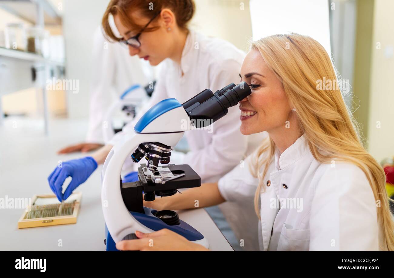 Group of scientists working at the laboratory Stock Photo - Alamy