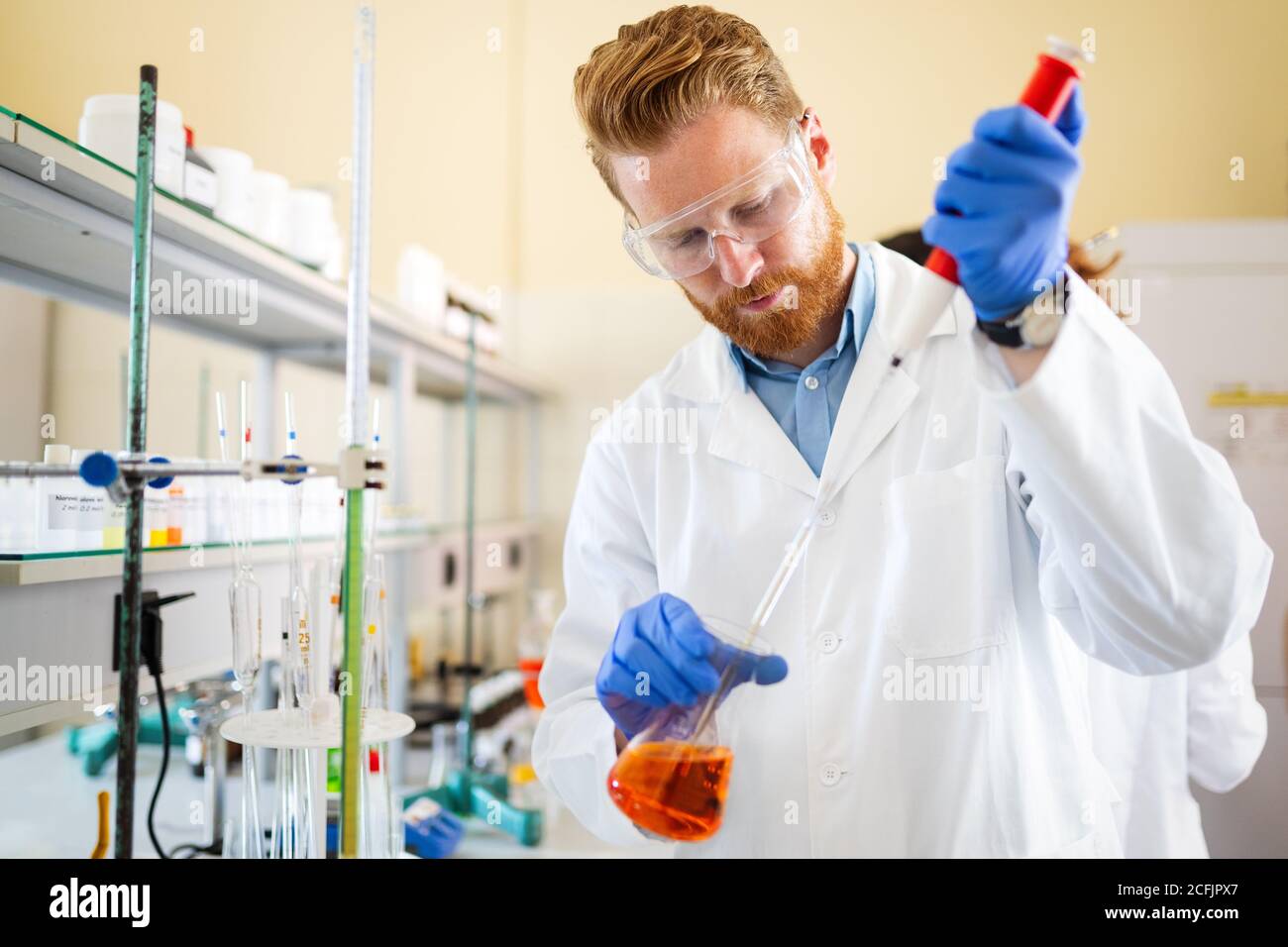 Young scientist student man working at the laboratory Stock Photo - Alamy