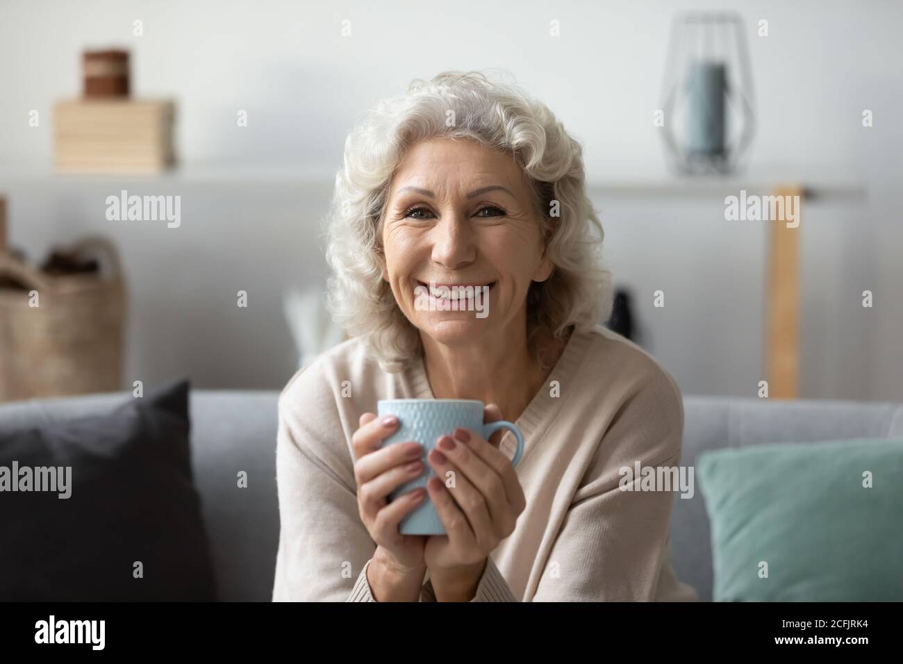 Woman smiling mature portrait tea hi-res stock photography and images ...