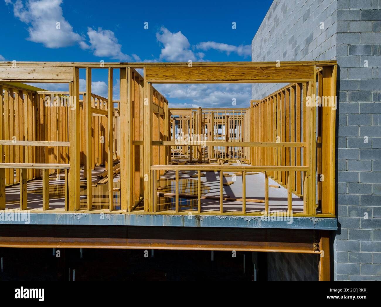 Framing of under construction wooden house building frame structure on ...
