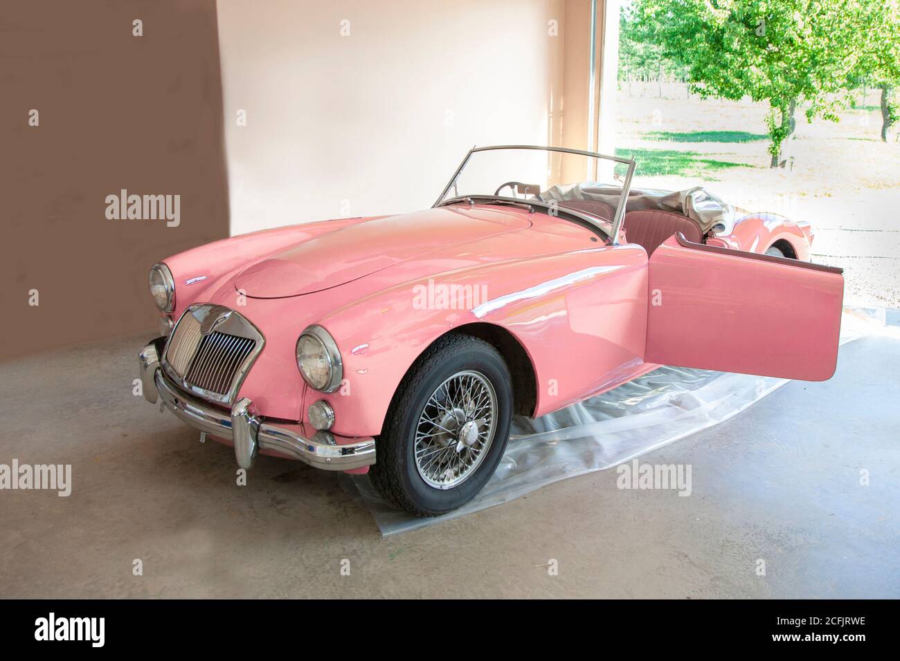 beautiful top down pink car in the shed well loved and ready to ride ...