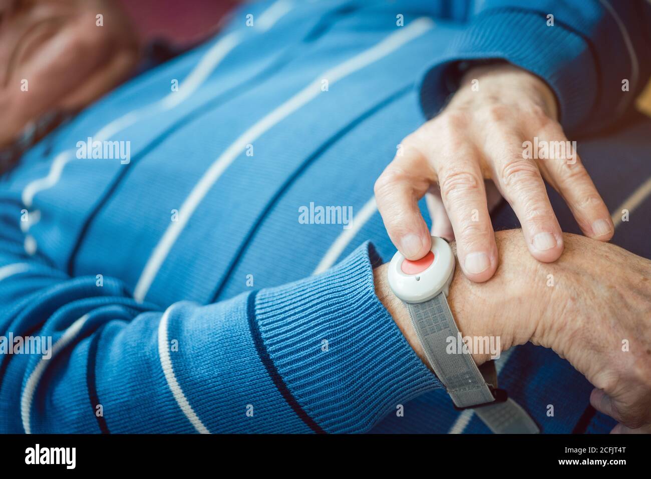 Senior man fallen pressing red button on emergency call device Stock ...