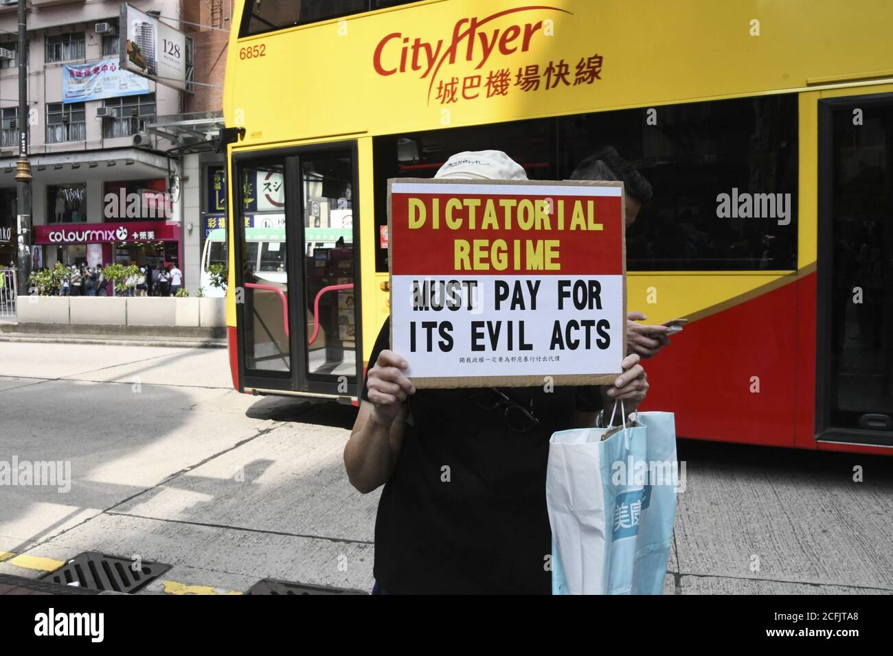 A protester holds up a signboard during a pro-democracy rally in Hong ...