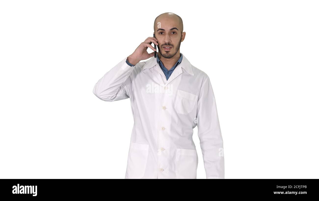 Doctor talking on mobile walking hi-res stock photography and images ...