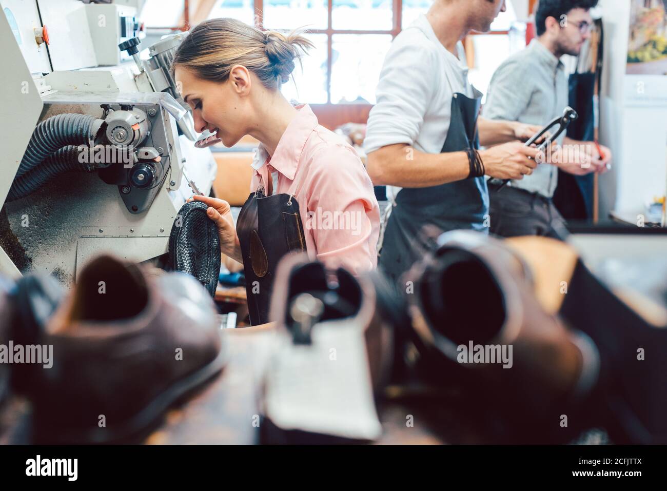Shoes waiting to be repaired in workshop of cobbler Stock Photo - Alamy
