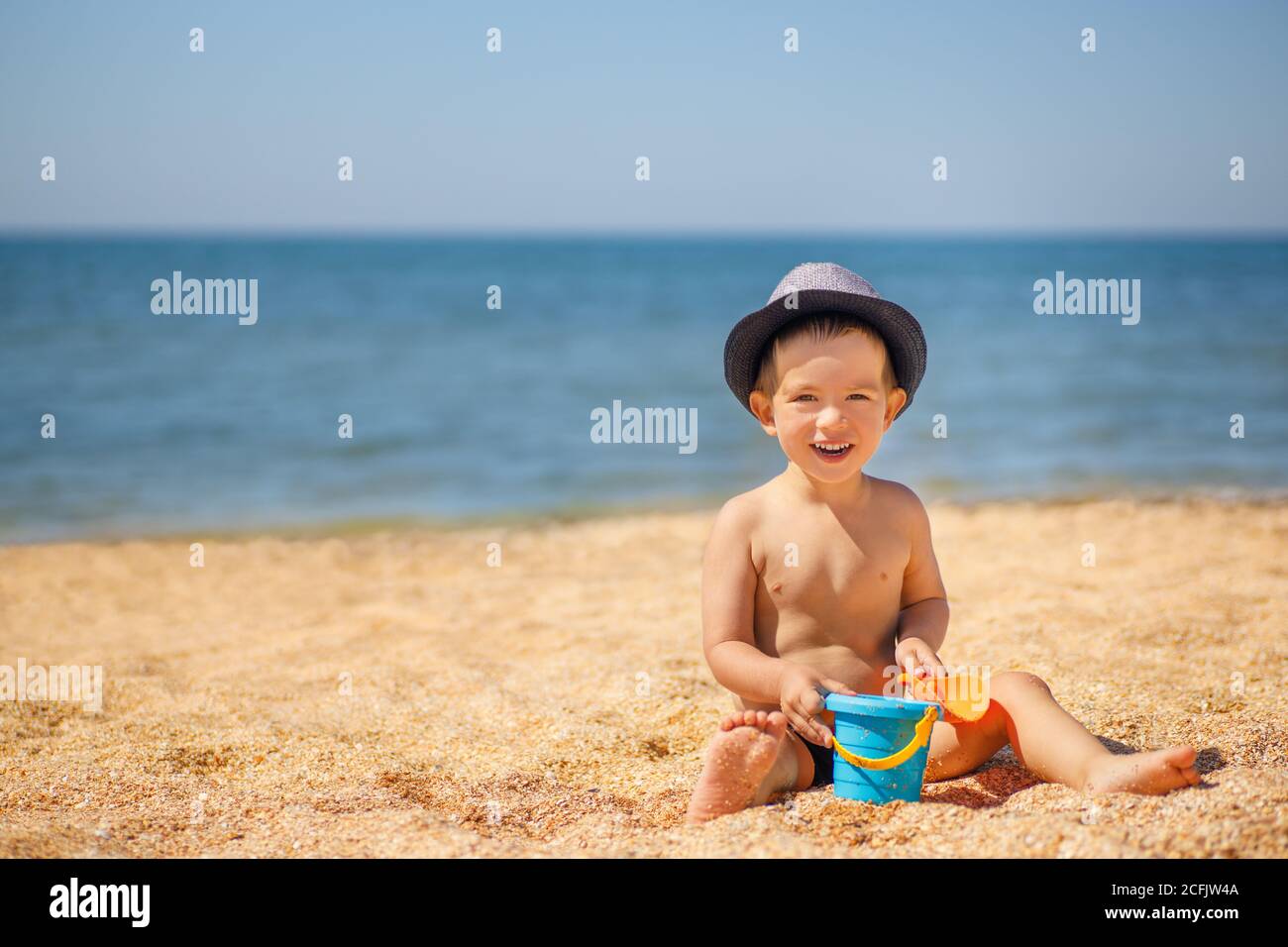 little boy playing on the sea beach Stock Photo - Alamy