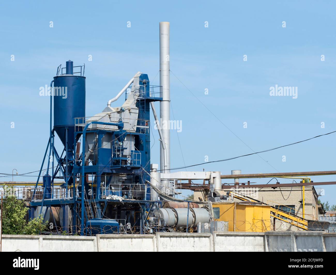 Horizontal photo of a blue industrial building on a factory Stock Photo ...