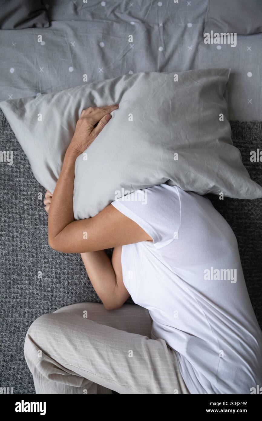 Top View Sleepless Mature Woman Lying On Bed Insomnia Concept Stock
