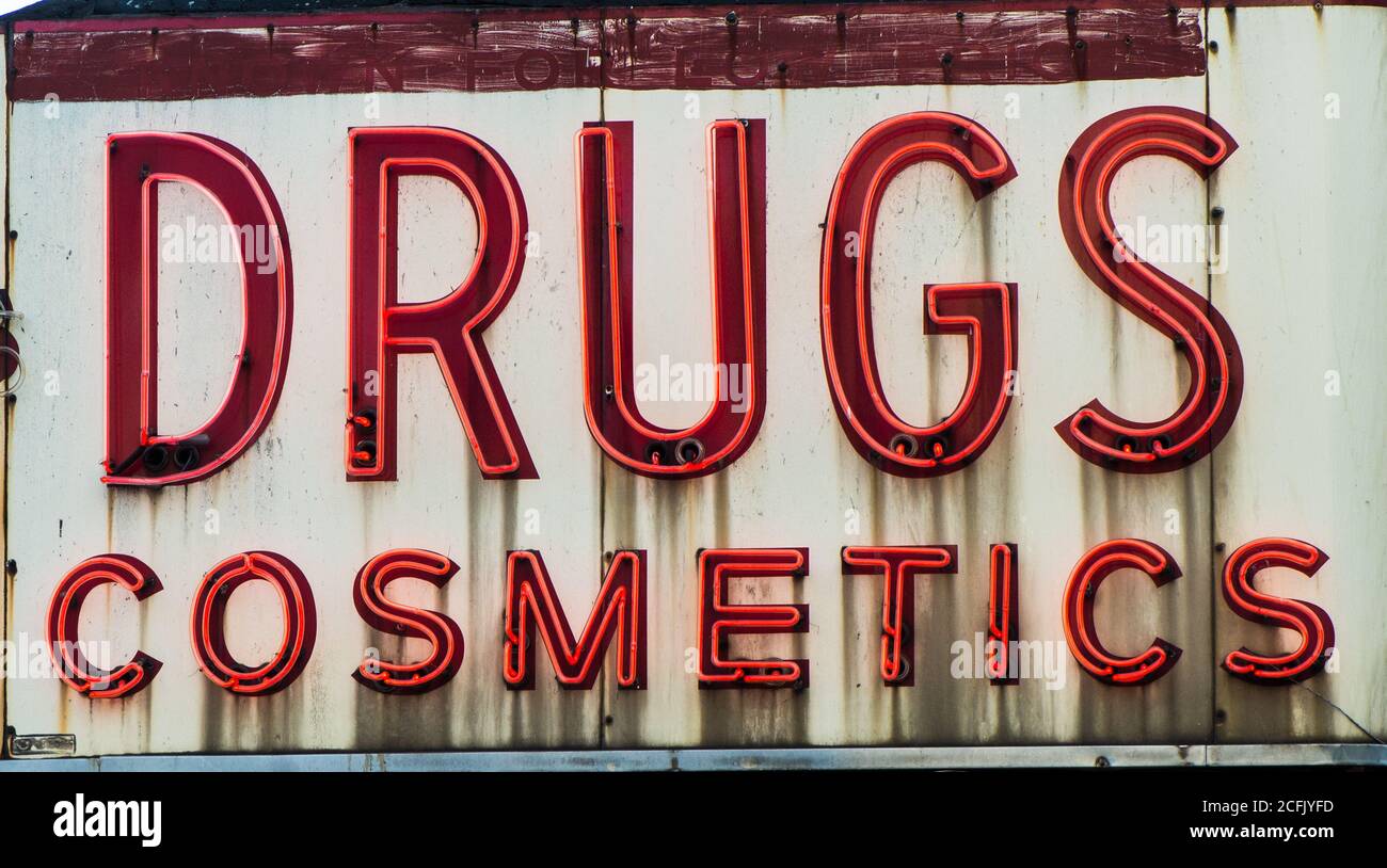 Old vintage drugs and cosmetics neon sign of an old pharmacy Stock ...