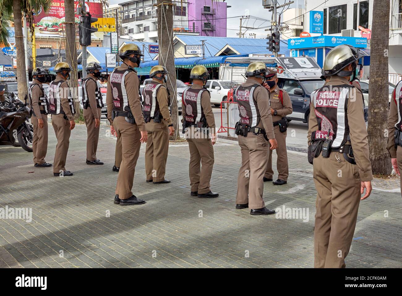 Thailand police line up of officers standing to attention and receiving ...