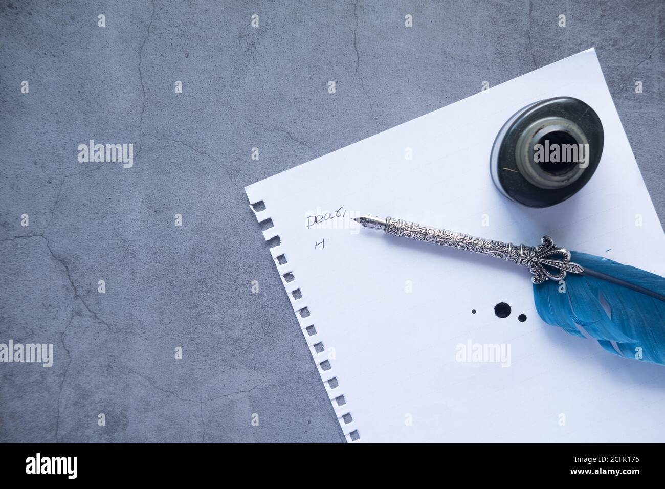 top view of empty paper, fountain pen and ink on black background Stock ...