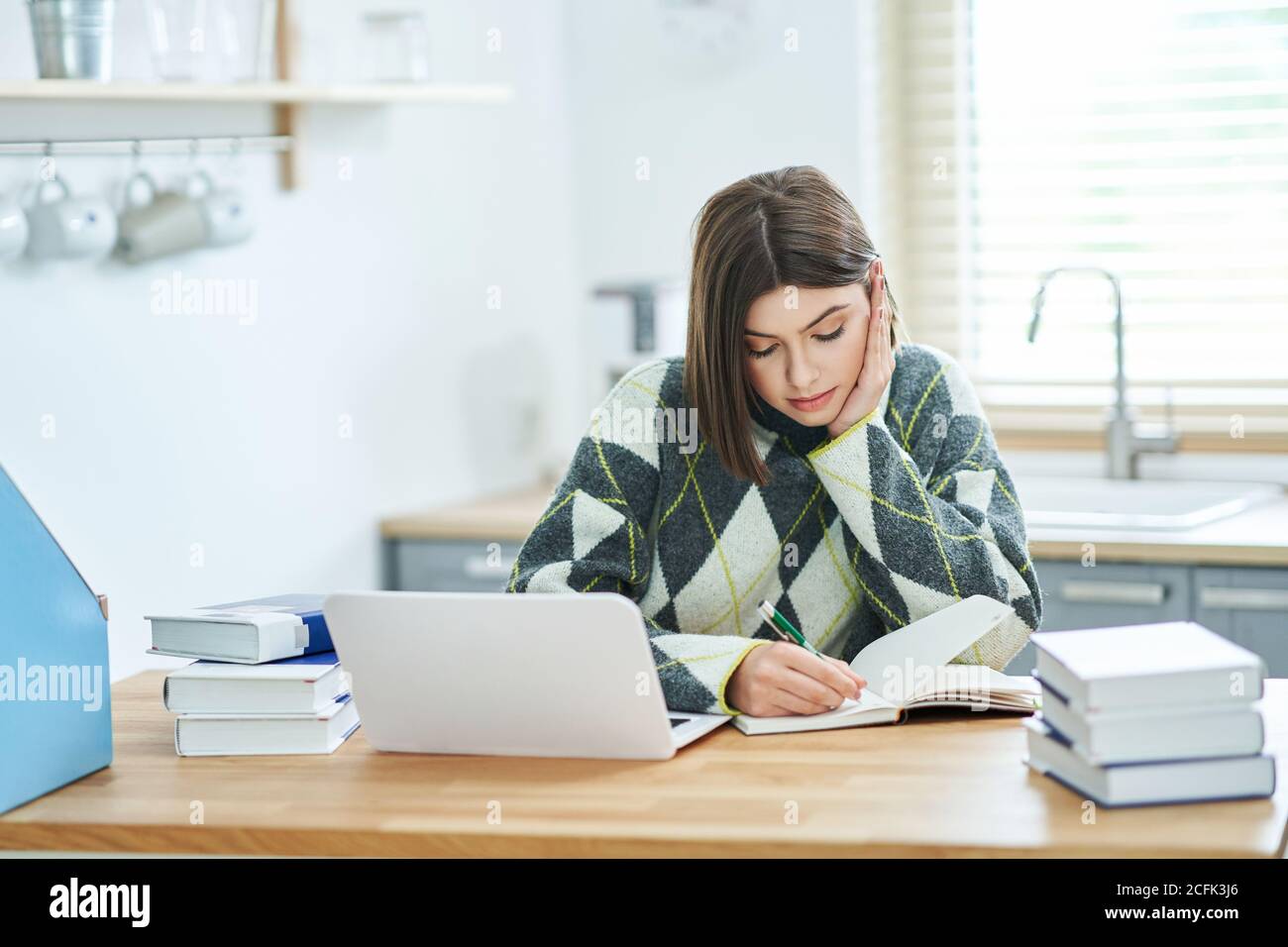 Teenage girl having online classes at home Stock Photo - Alamy