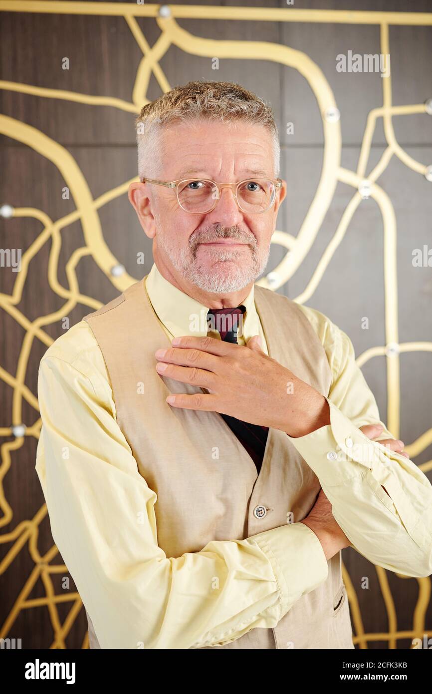 Smiling experienced entrepreneur Stock Photo - Alamy