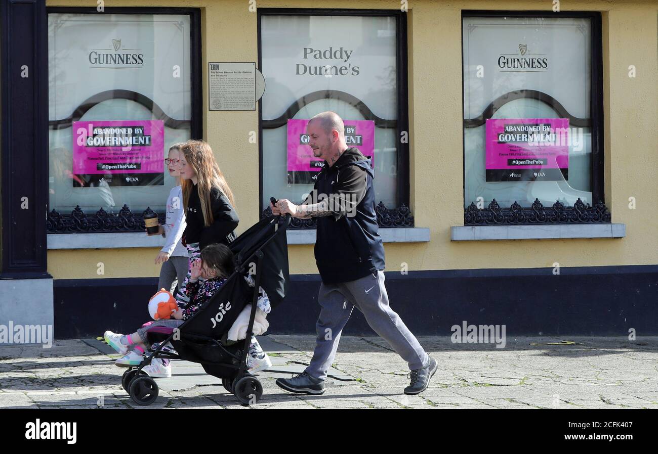 PARENTAL PERMISSION GIVEN People walk past Paddy Dunne's, a pub in Athy ...