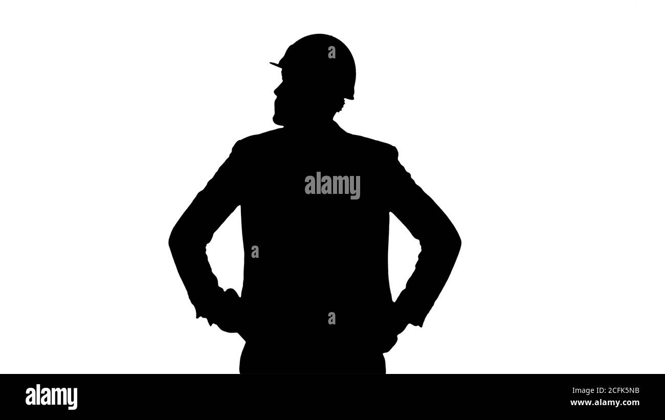 Silhouette Engineer standing and looking around Stock Photo - Alamy
