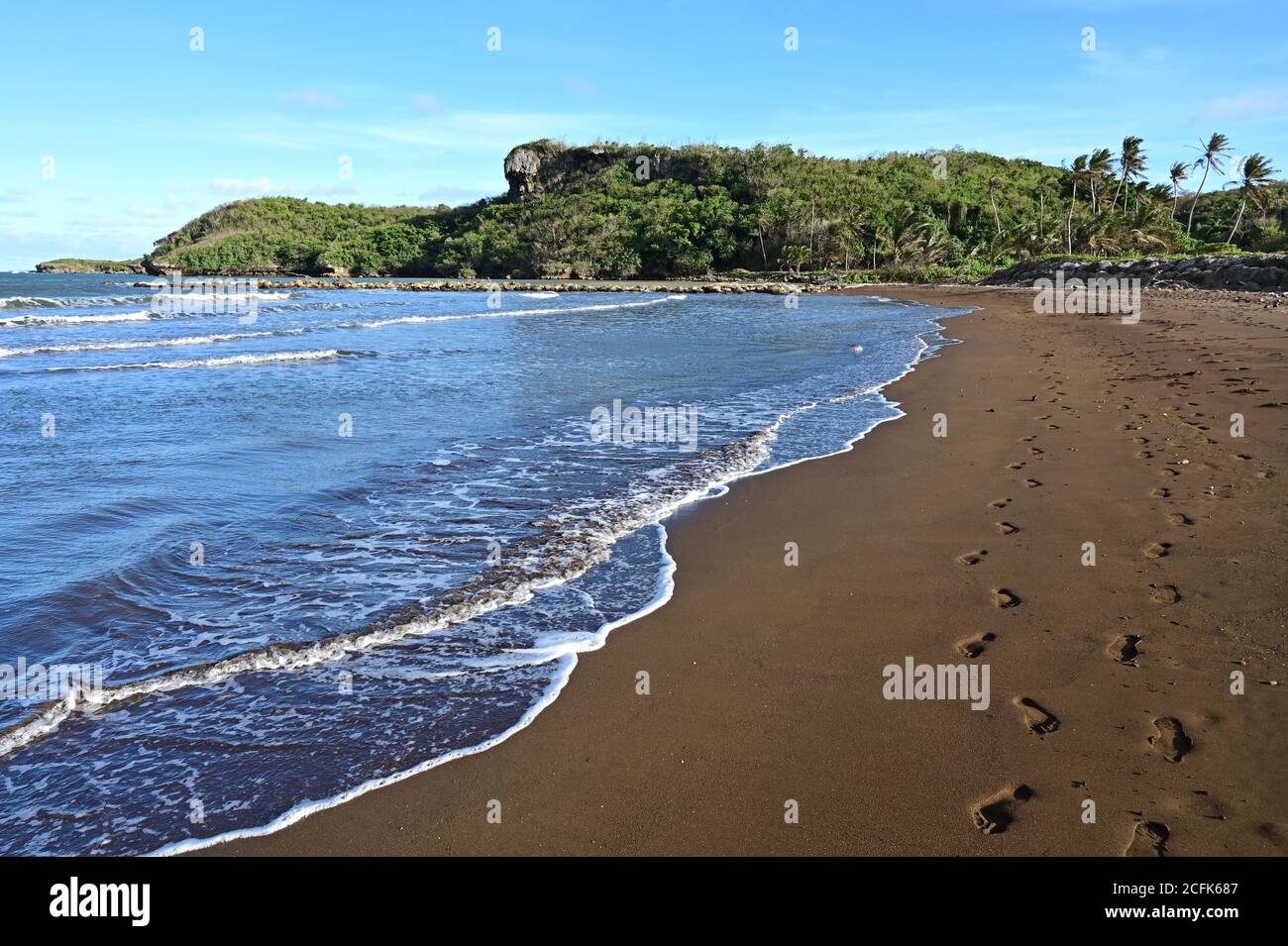 The Black Sand Beach of Talofofo bay on Guam Stock Photo - Alamy