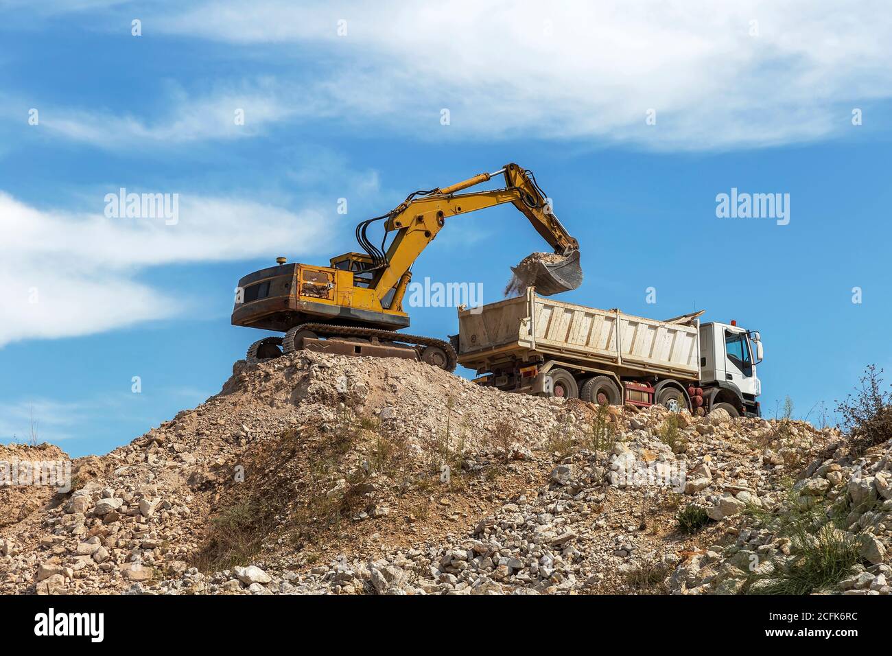 loader and truck on construction site Stock Photo - Alamy