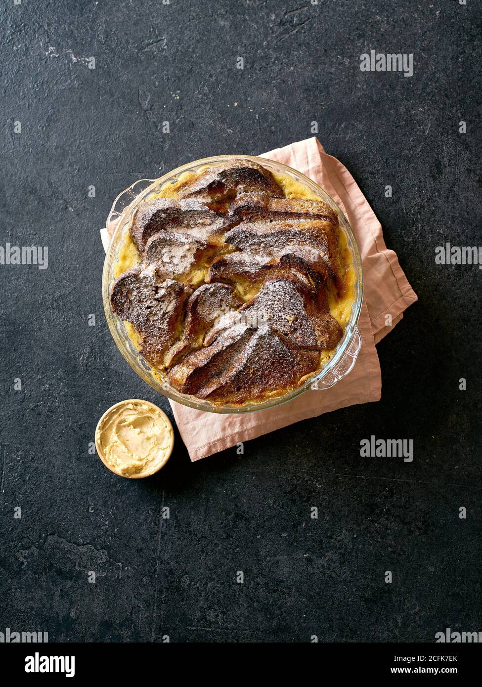 Top view of traditional bread pudding with custard, served with ...