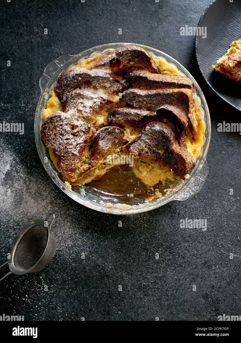 Top view of traditional bread pudding with custard, served with ...