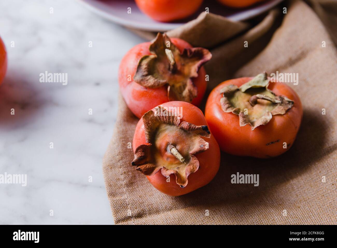 Pile of persimmons hi-res stock photography and images - Alamy