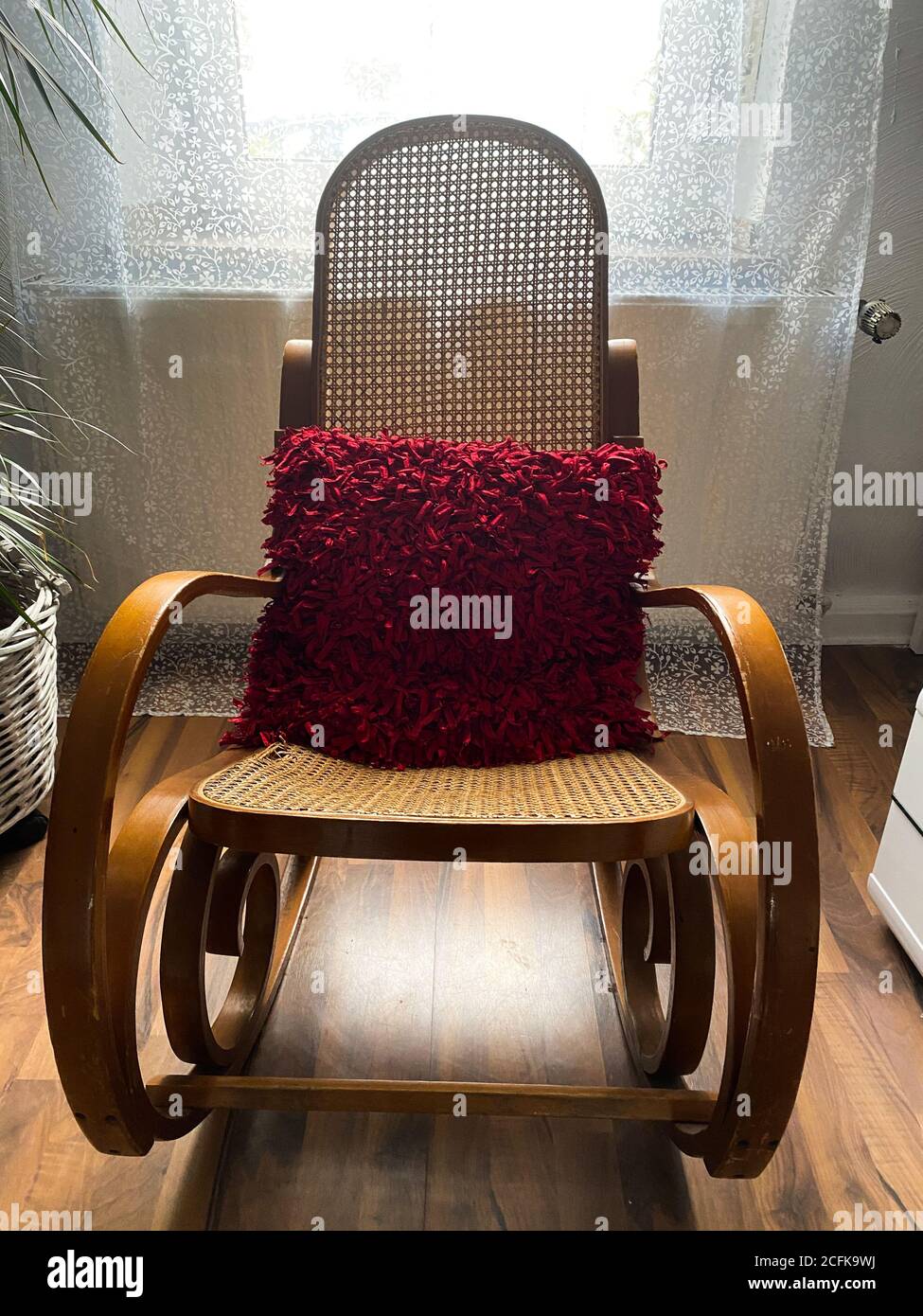 View on empty rocking chair in living room with shadow from backlight ...