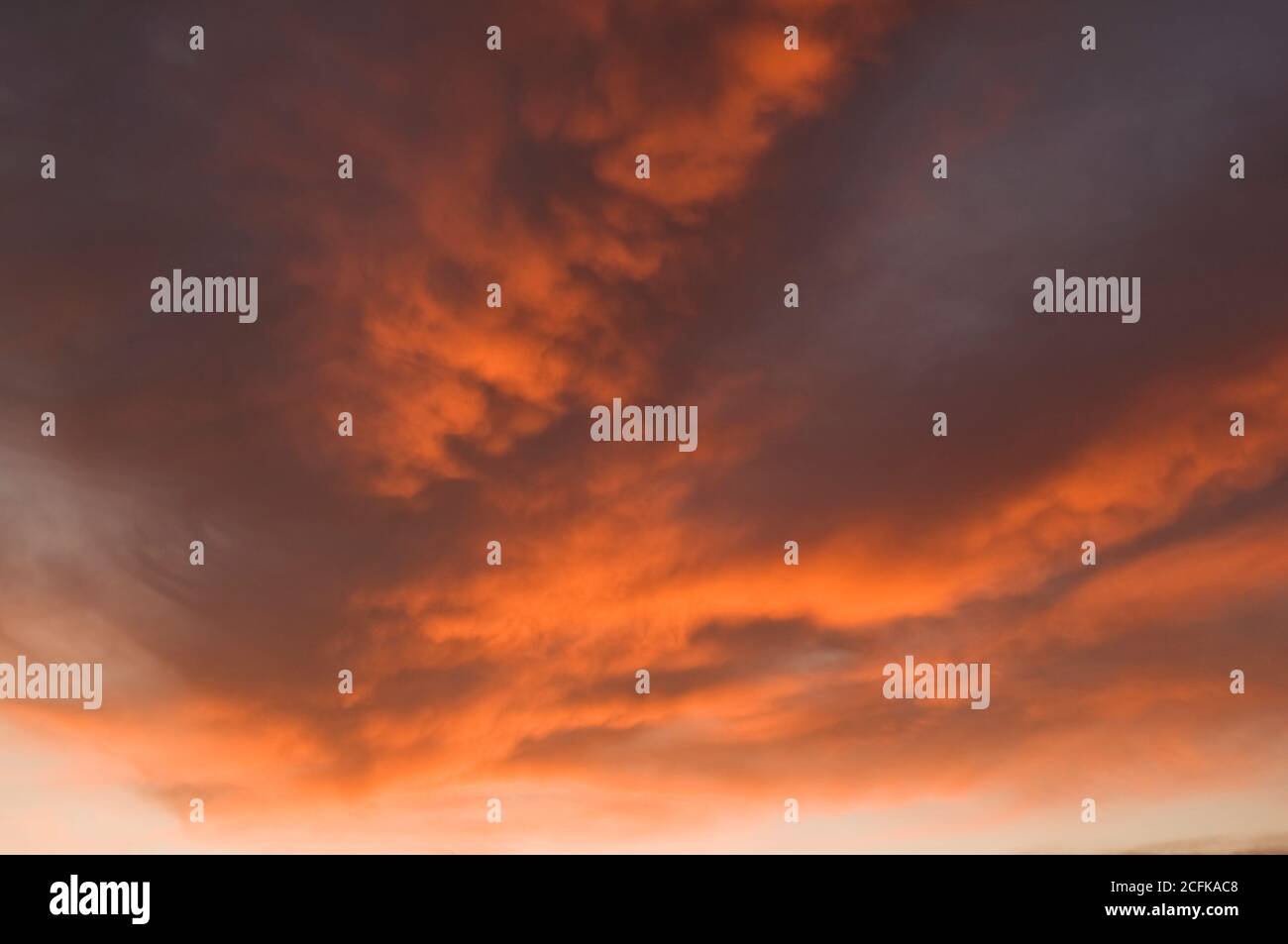Fire sky background. Soft clouds with the hint of the sun at sunset ...
