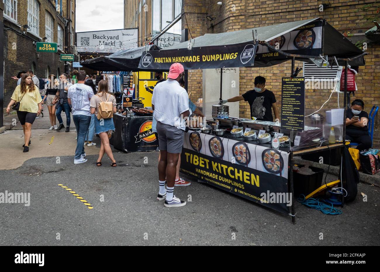 Food stalls on Brick Lane Market offering visitors and tourists a ...