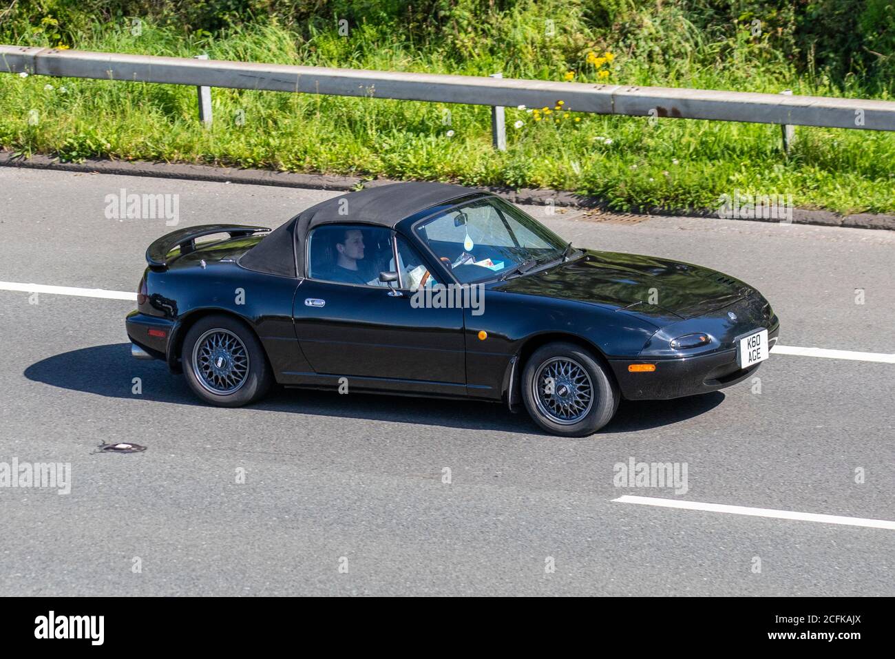 1992 90s nineties black Mazda Mx-5 MX5 K60AGE; Vehicular traffic moving ...