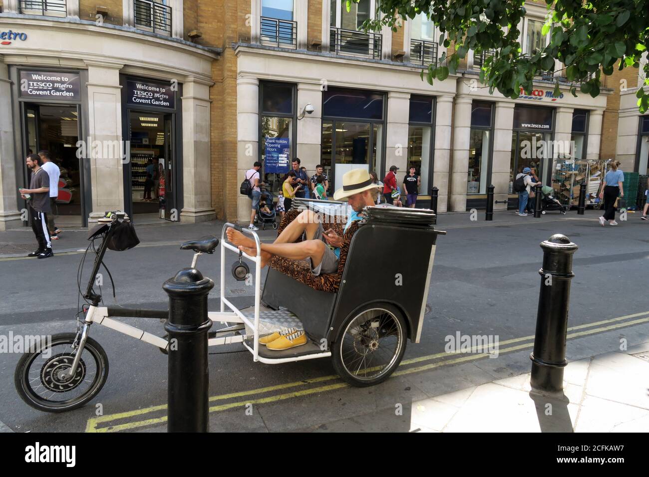 London Covent Garden pedicab driver taking a break Stock Photo - Alamy