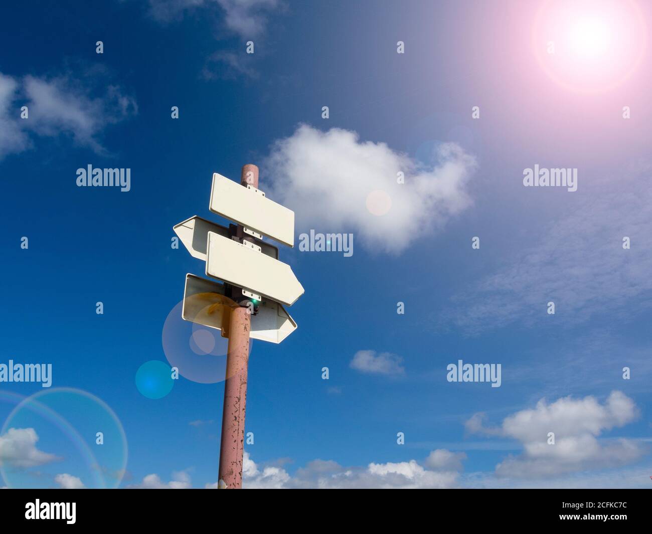 Blank arrow pointers on the pole. Direction marks on the mountain top ...