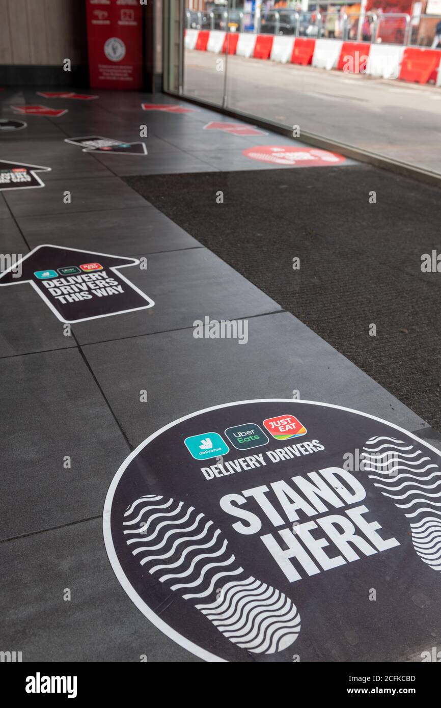 Social distancing marking on floor of a branch of KFC indicating the ...