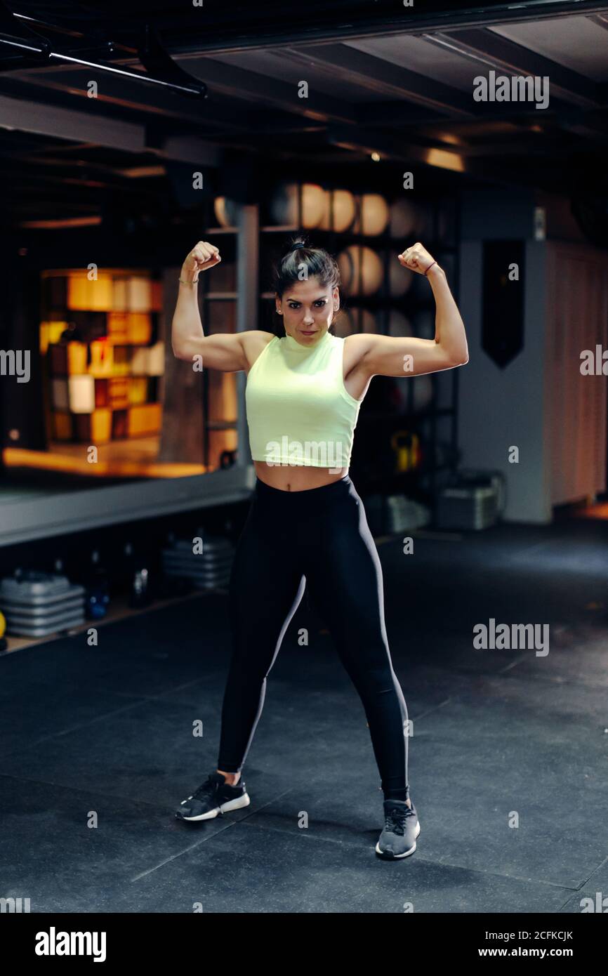 Flexing her muscles hi-res stock photography and images - Alamy