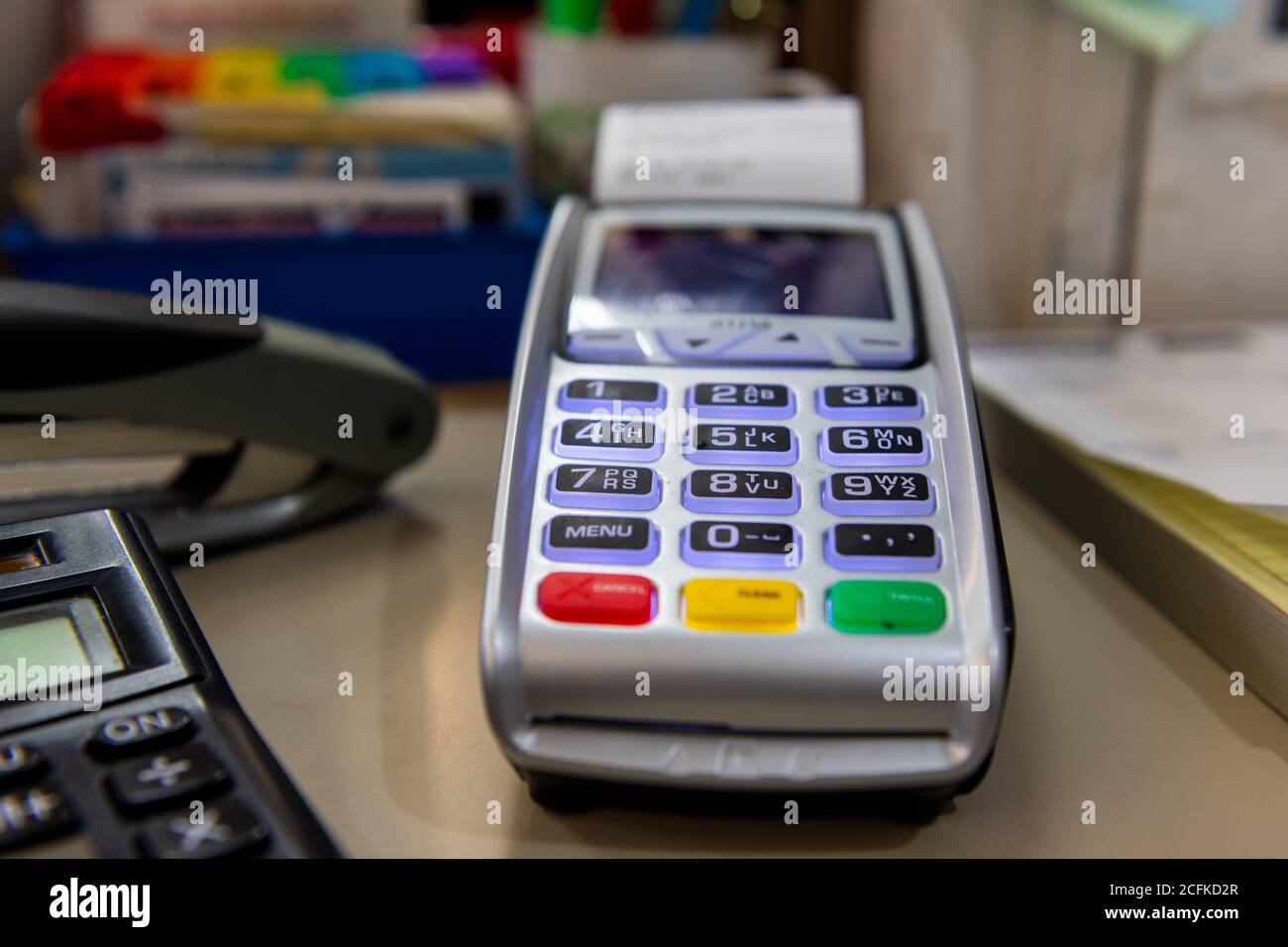 A electronic card payment terminal or card reader on the sales desk of ...