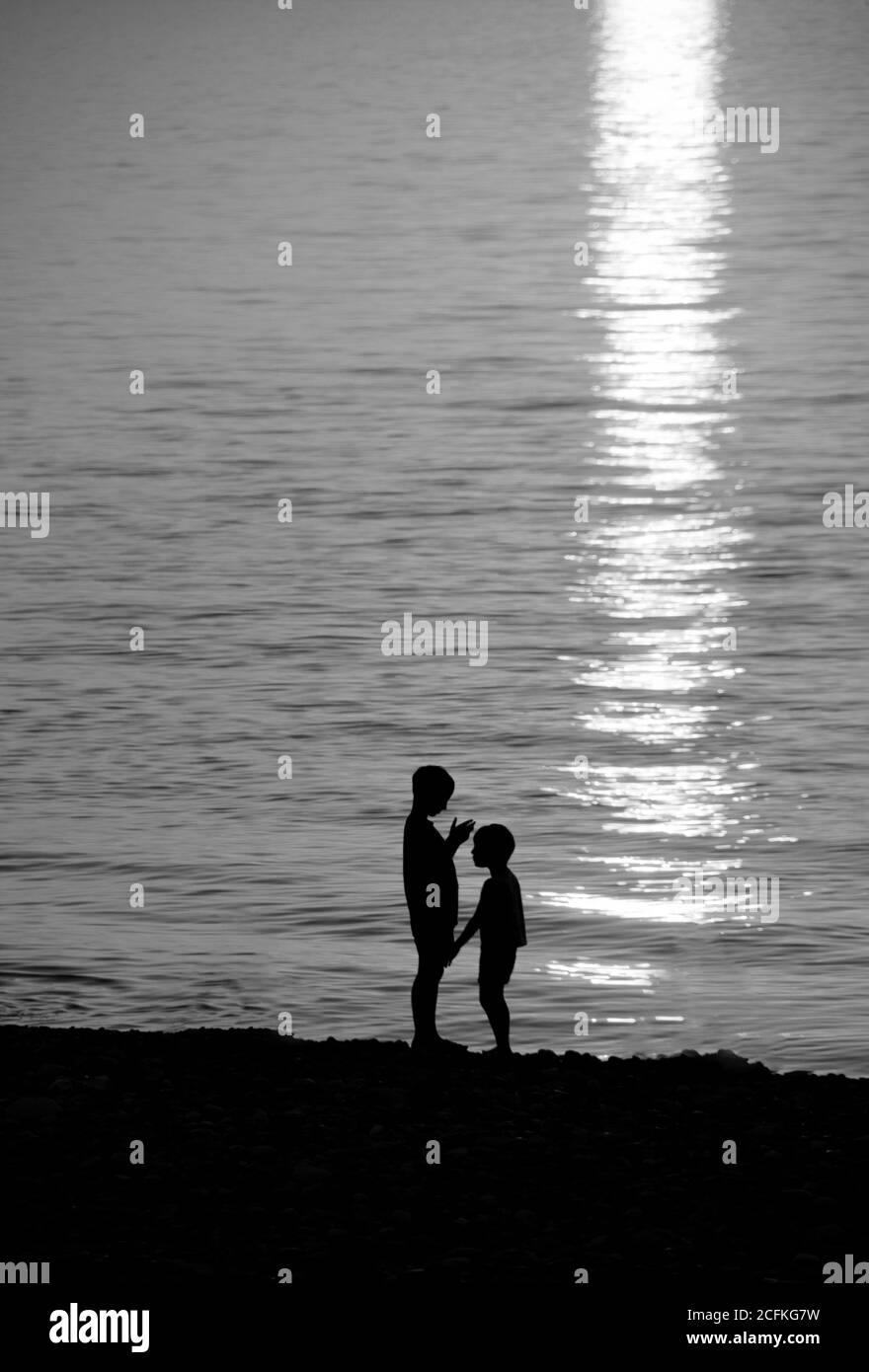 Children in sunset at the sea. Batumi. Georgia Stock Photo - Alamy