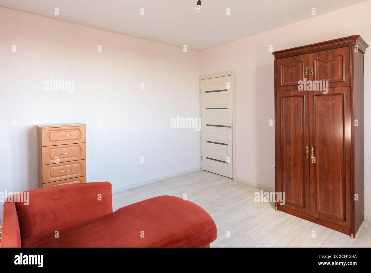 Room interior with modest old furniture Stock Photo - Alamy