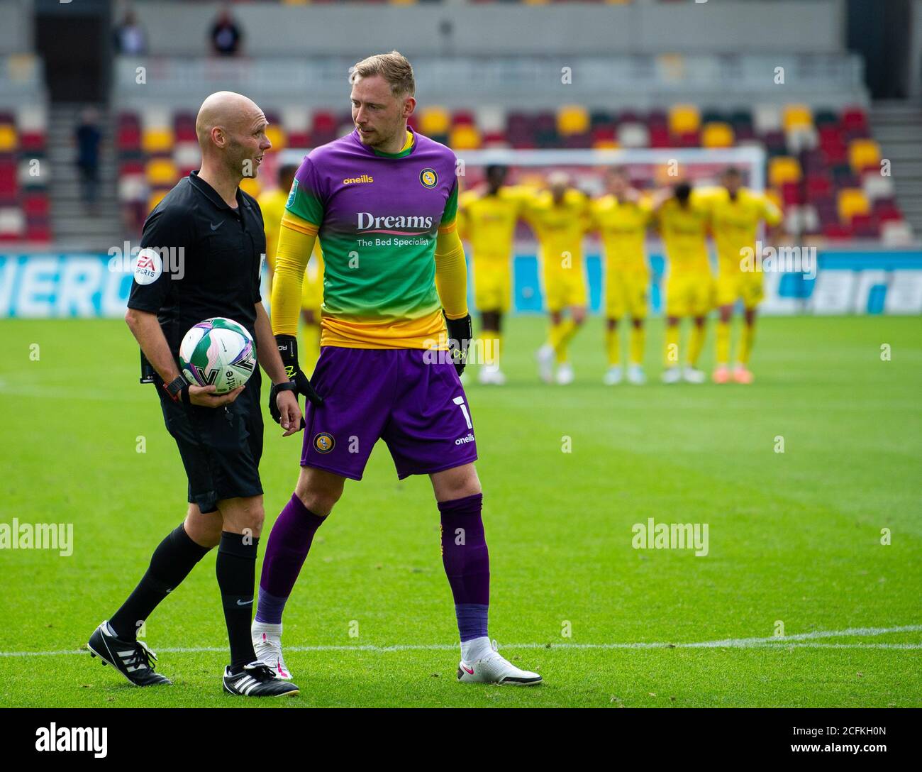 Referee Charles Breakspear talking to Wycombe's Ryan Allsop during the ...