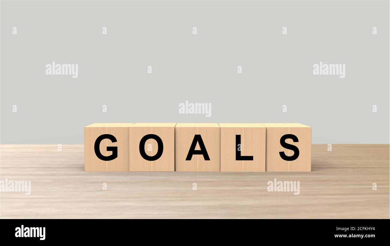 Goals word Wooden cubes on table horizontal over gray light background ...