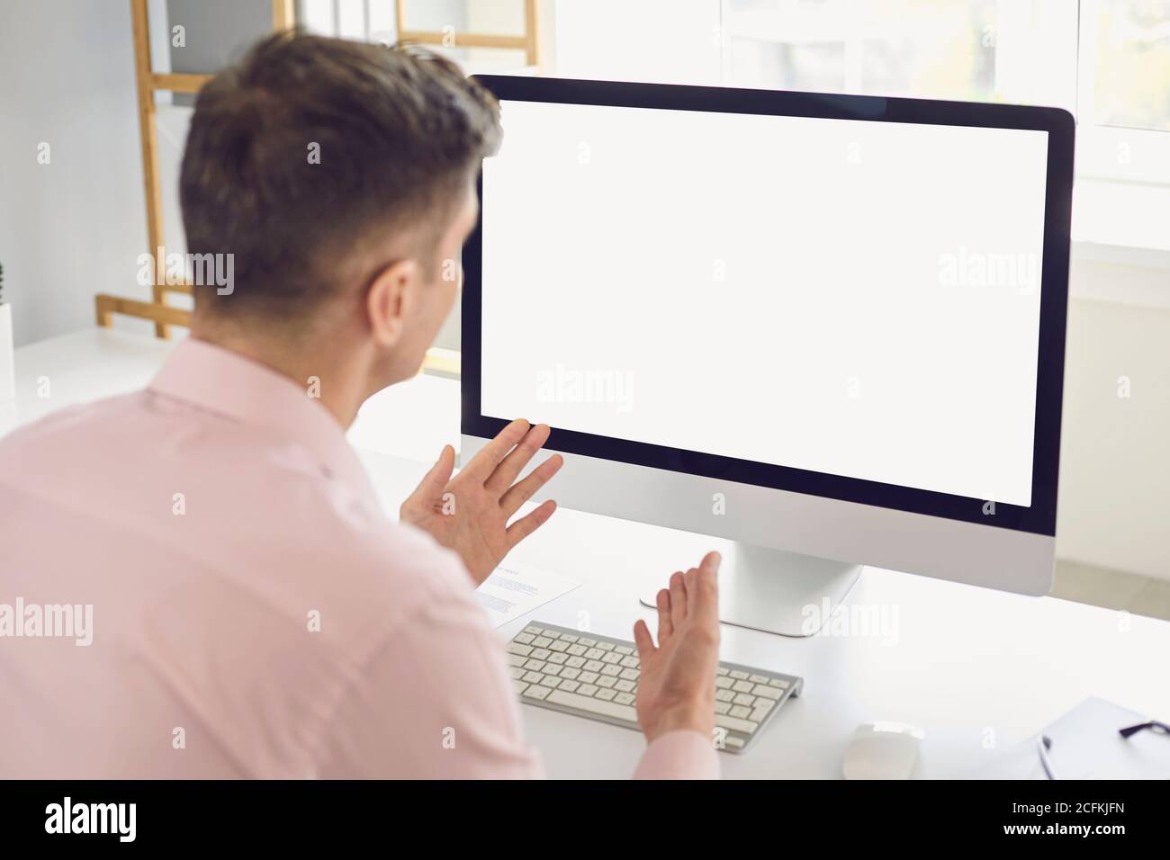 Man using personal desktop computer for teleconference communicating ...