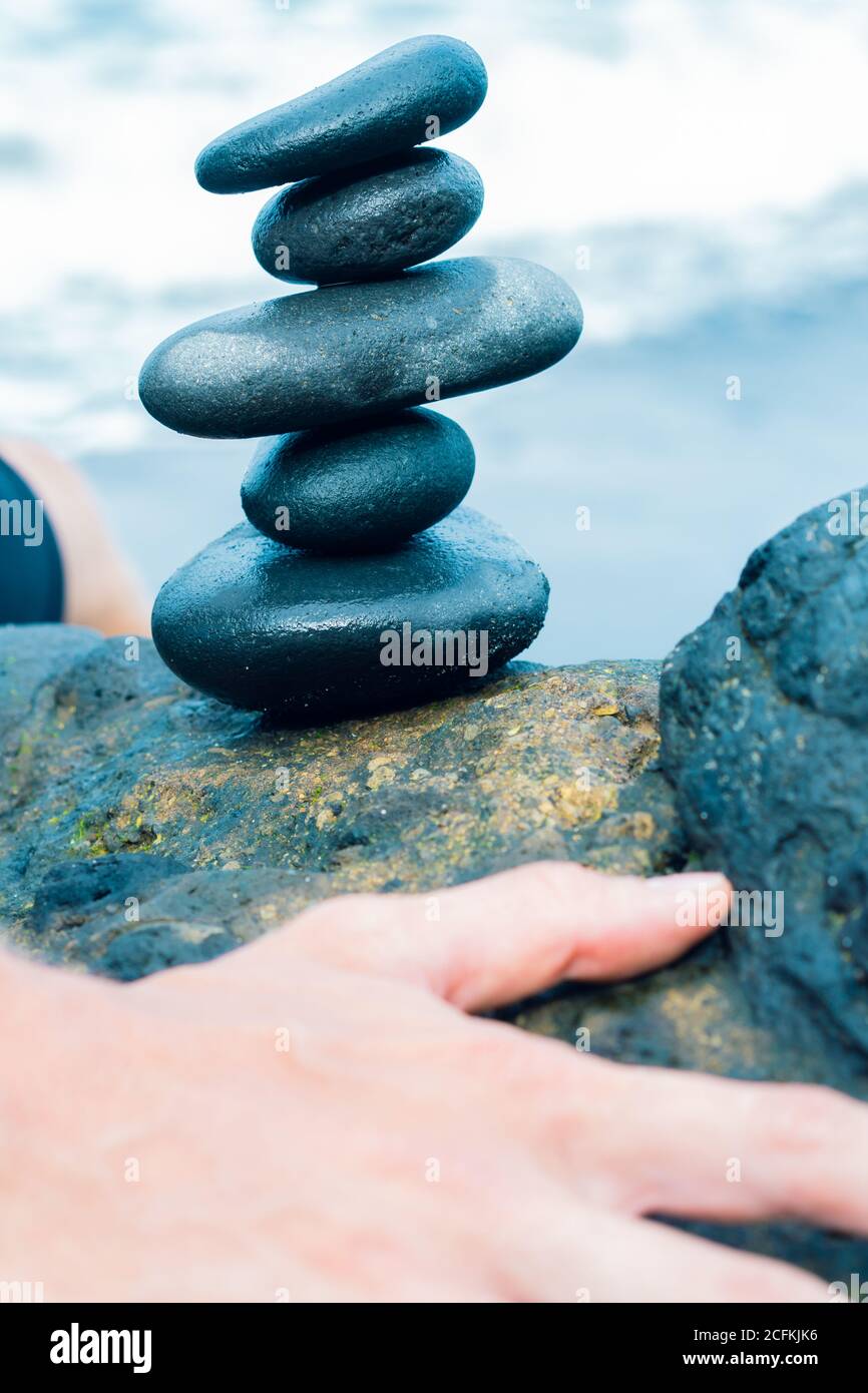Balancing stones arranged in a pyramid shape Stock Photo - Alamy