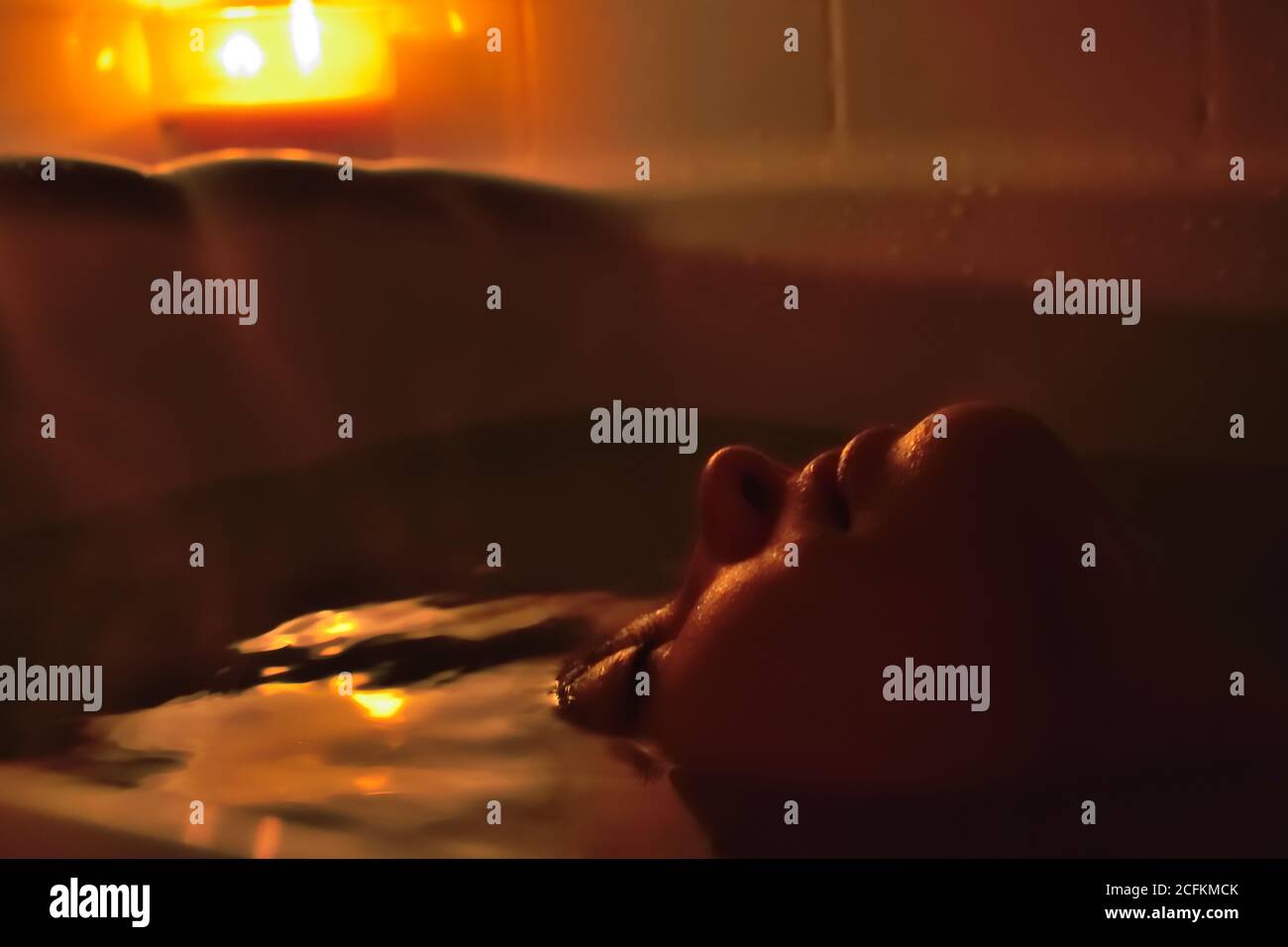 Person in the Bath with Their Head in the Water Stock Photo - Alamy