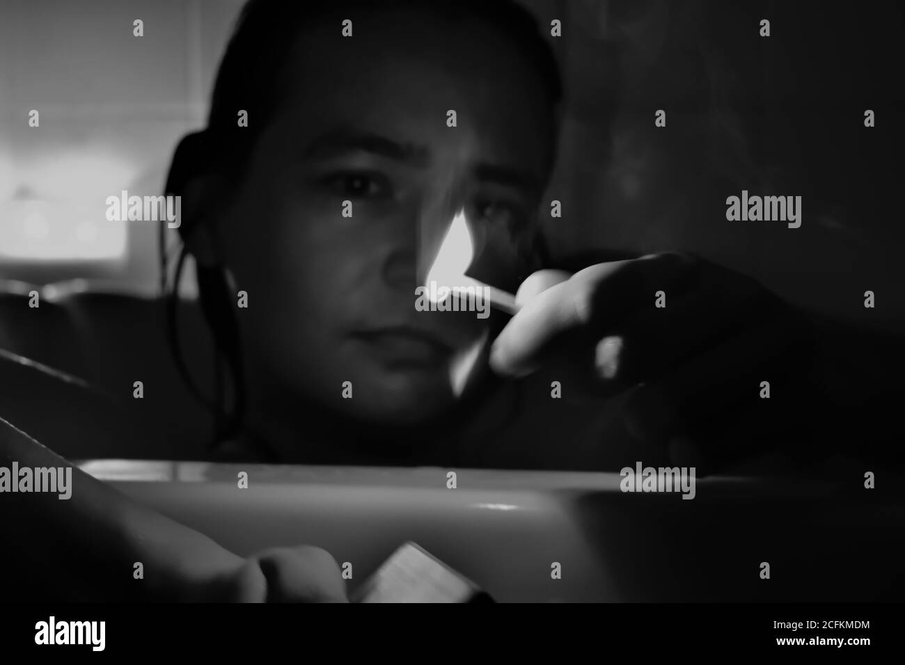 Person Lighting a Match in a Bathtub Stock Photo - Alamy