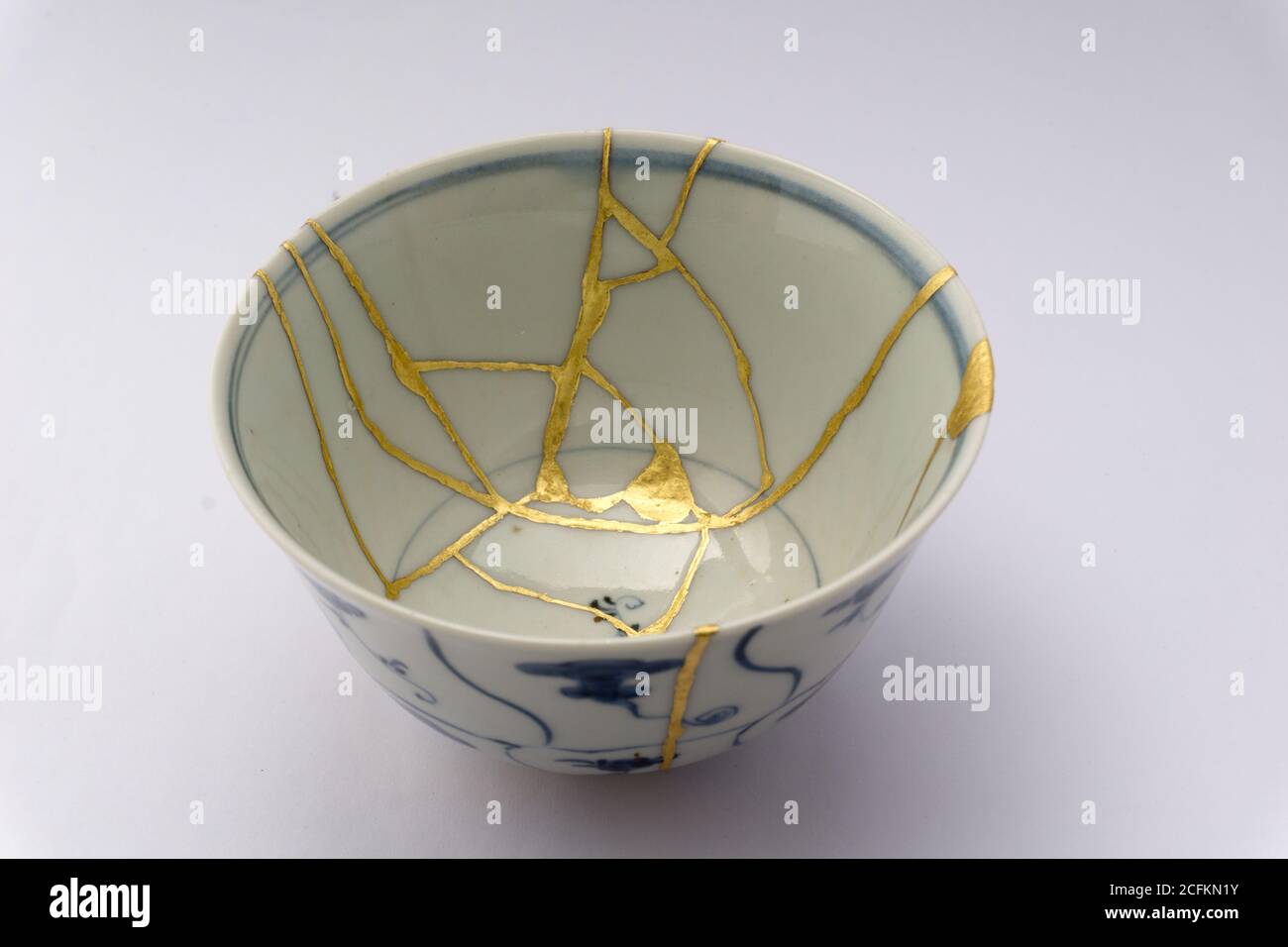 Kintsugi tea bowl ceremony chawan. Gold cracks restoration on old ...