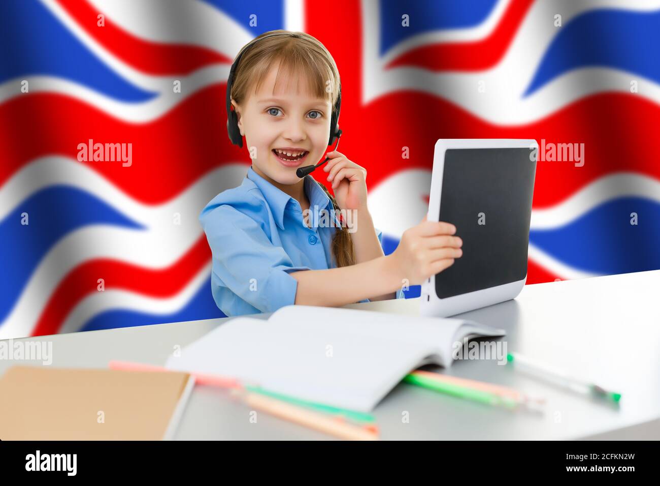 Little girl student with laptop on uk flag background, England Stock ...