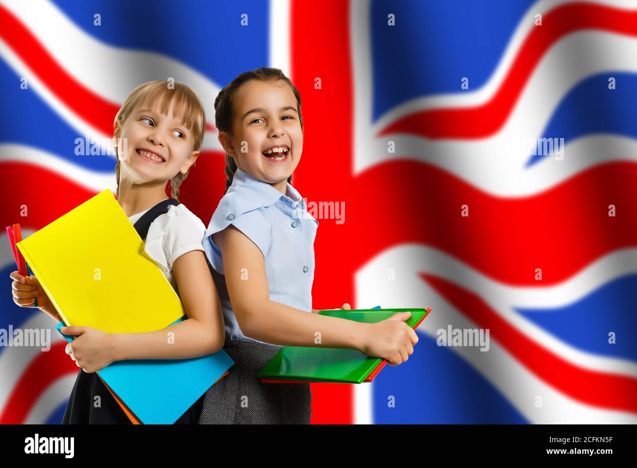 Little girls student with laptop on uk flag background, England Stock ...