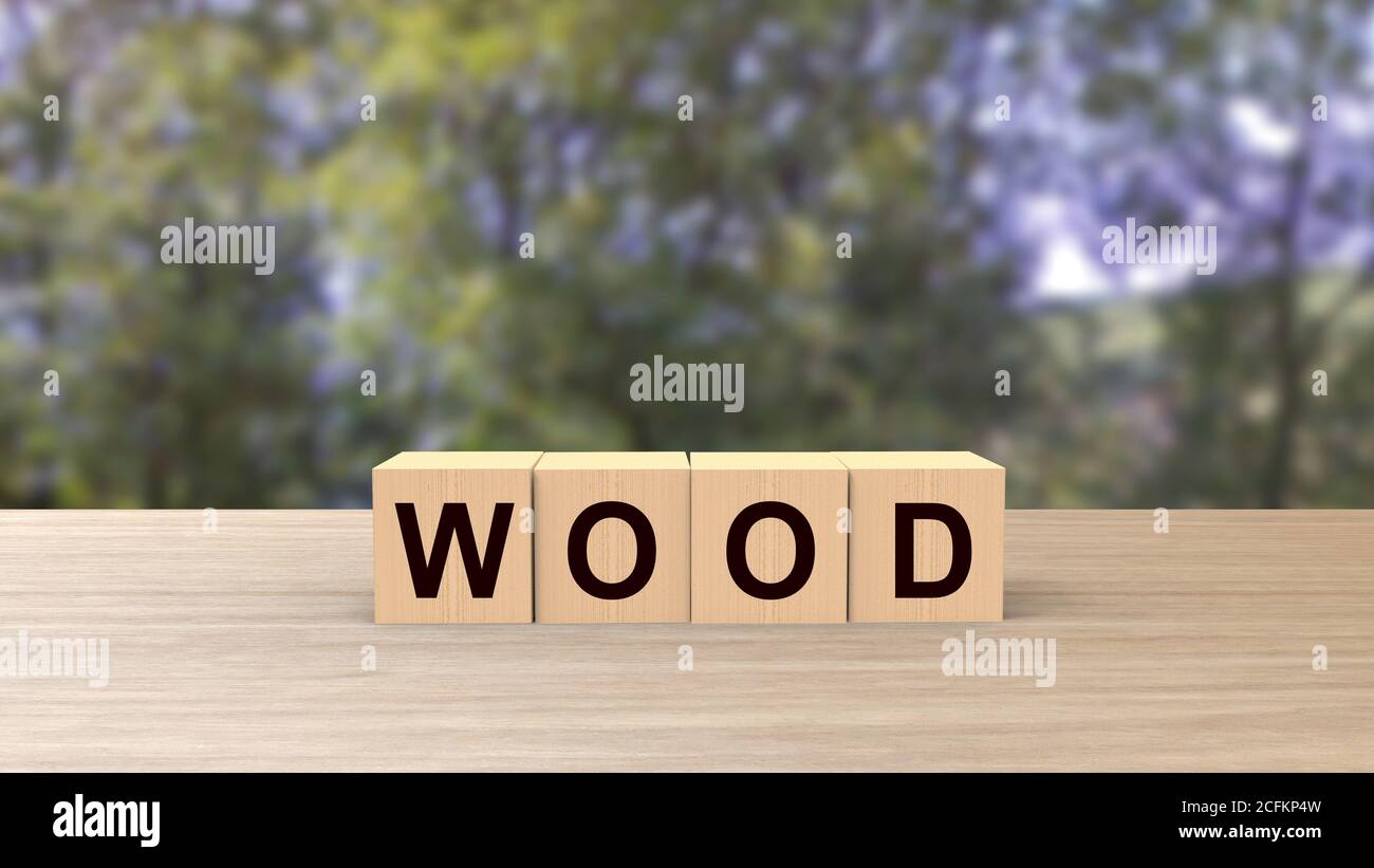 Wood word wooden cubes on table vertical over blur background with ...