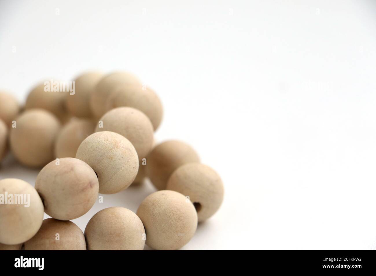 A beautiful string of wooden beads isolated on a white background Stock ...