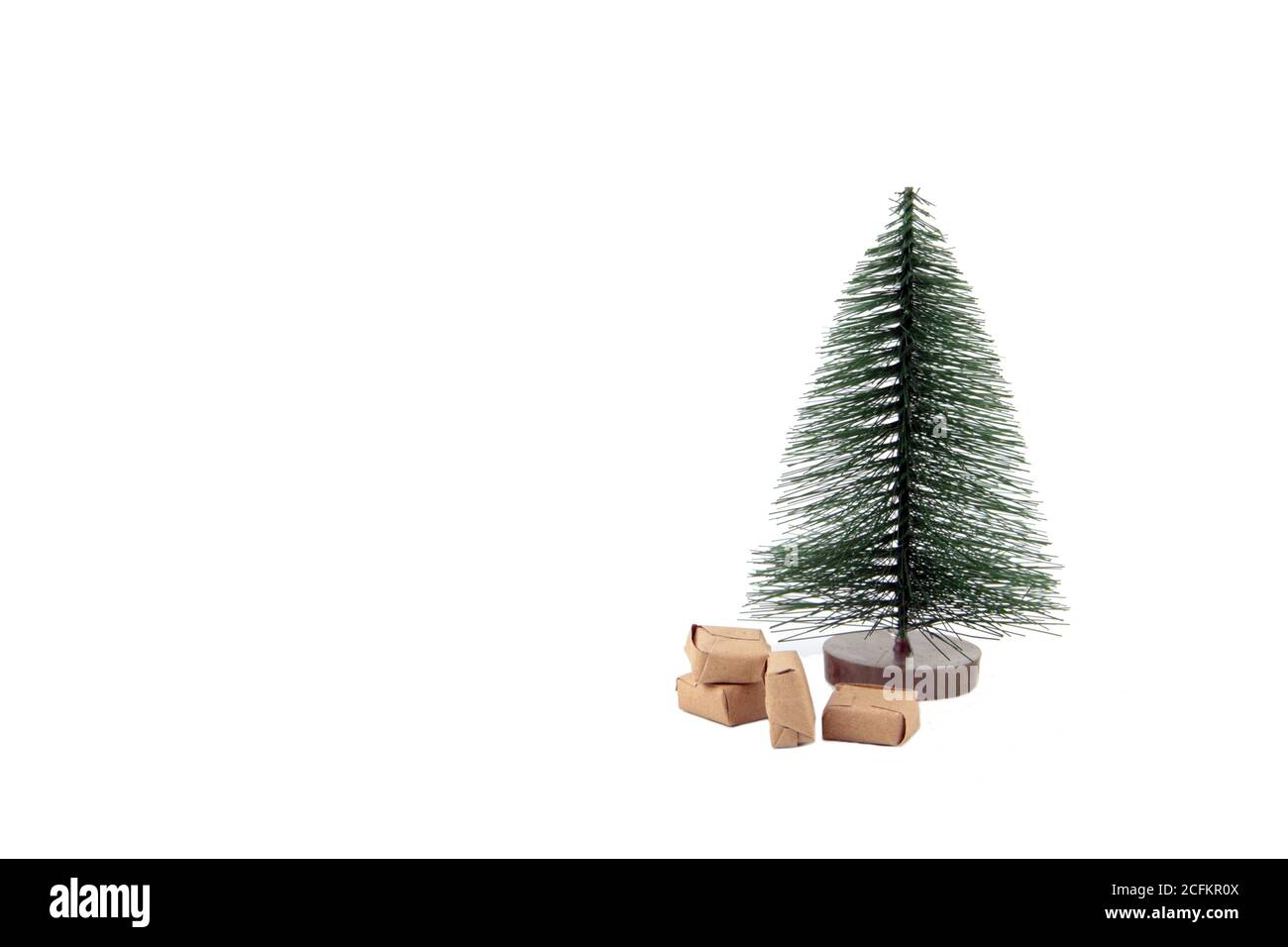 wrapped boxes under fir tree isolated on white background. Christmas ...