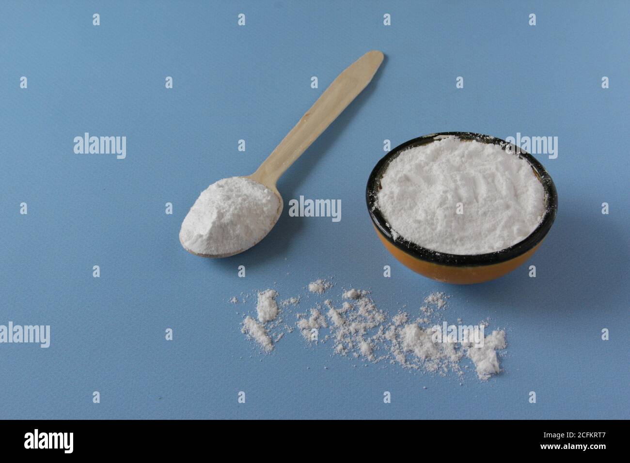 Collagen powder on blue background. Protein intake. Natural beauty and ...
