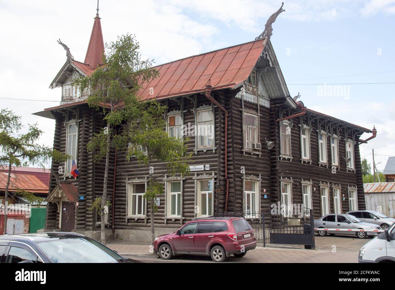 Old wooden buildings in a provincial Siberian town. Russian style in ...